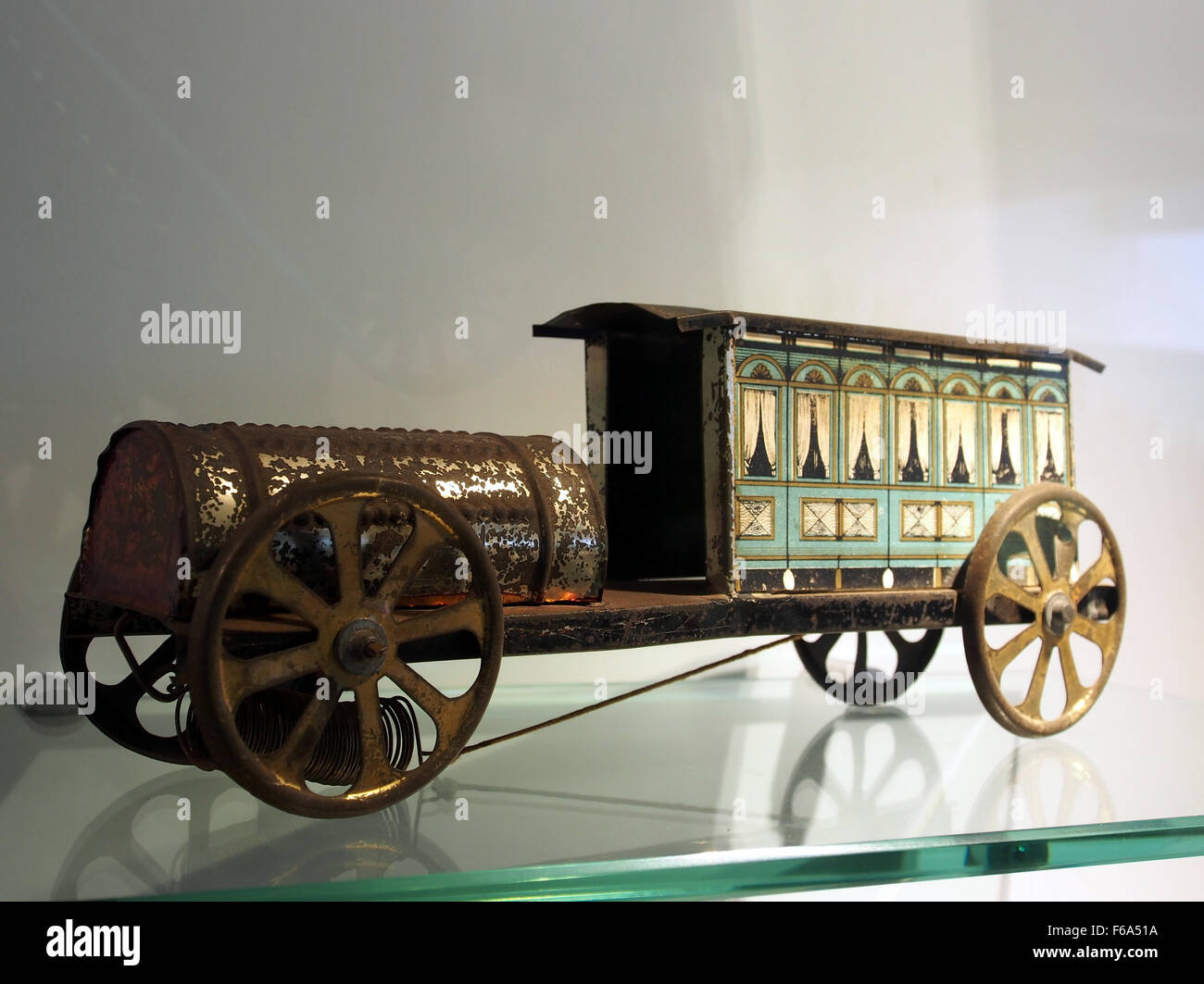 A vintage floor rider with a spring drive mechanism, manufactured by ...