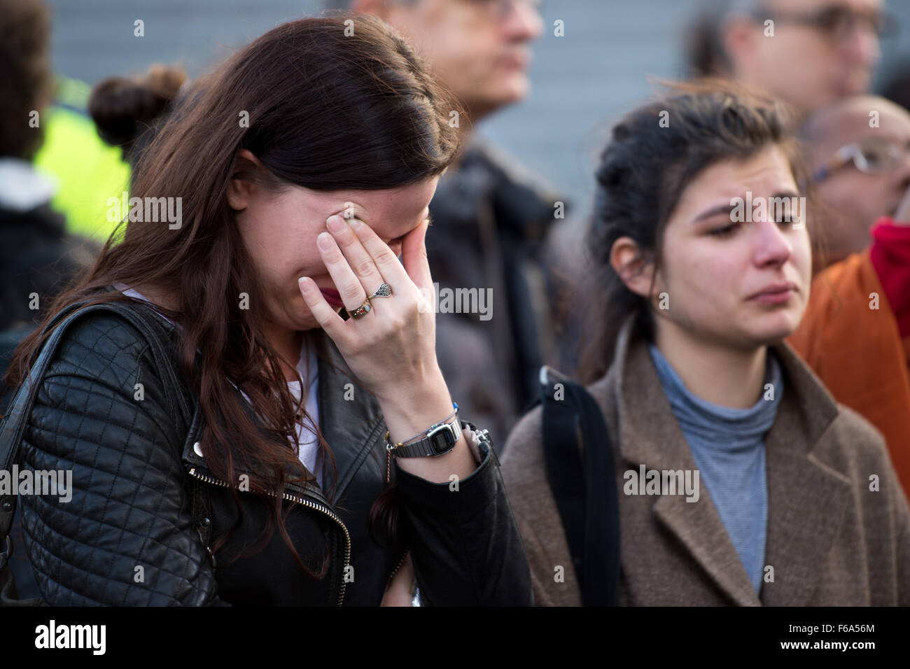 Paris, France. 15th Nov, 2015. Two women grieve in front of the Café ...