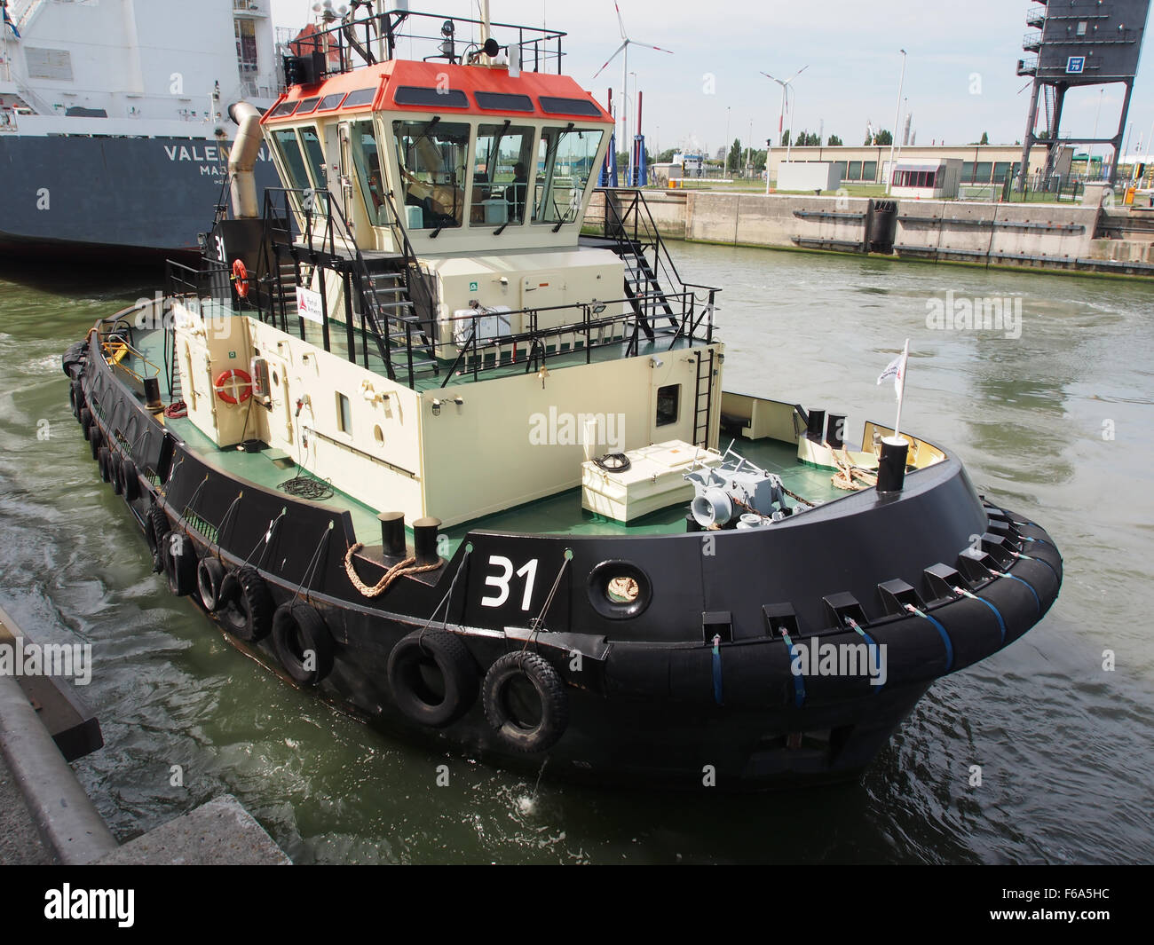 The tugboat 31, with IMO 9684031 and ENI 06105142, is seen operating at ...
