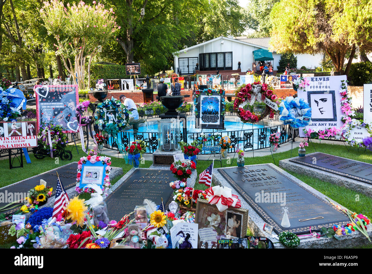 floral tributes at Elvis Presley's gravestone in the Meditation Garden ...