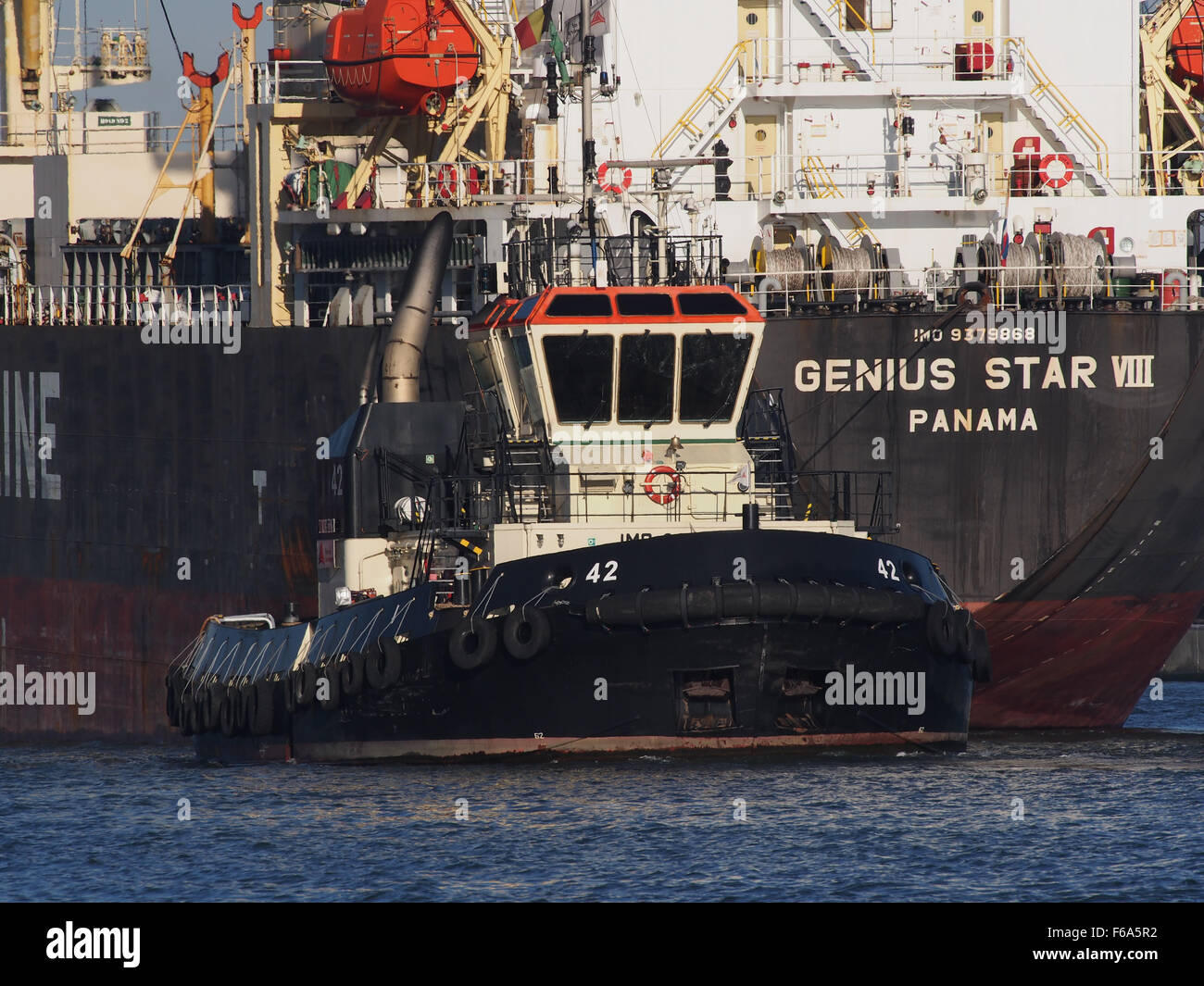 Tugboat 42 towing the Genius Star container ship through the Port of ...