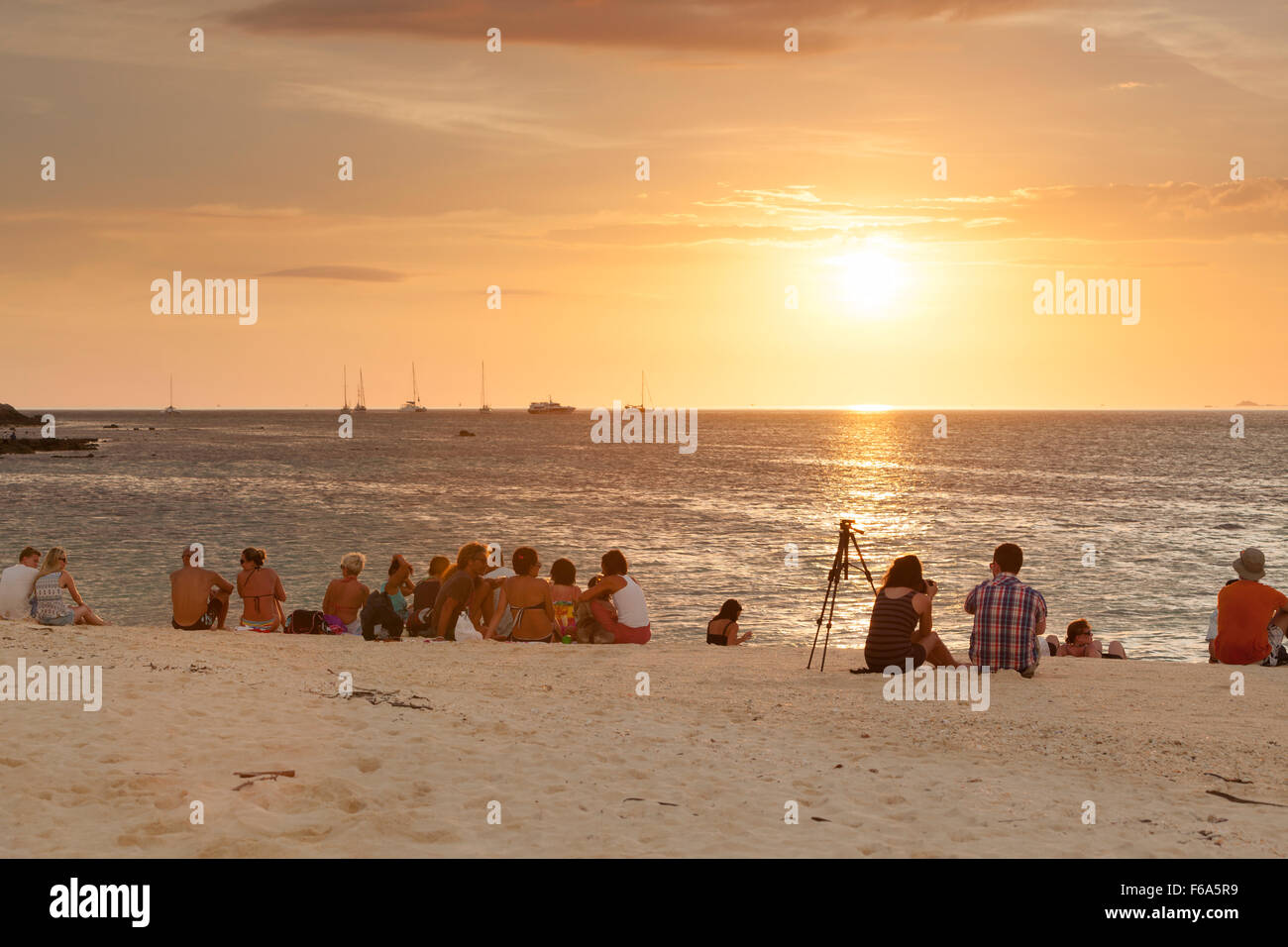 Watching the sunset on the beach, Ko Lipe island, Thailand Stock Photo ...