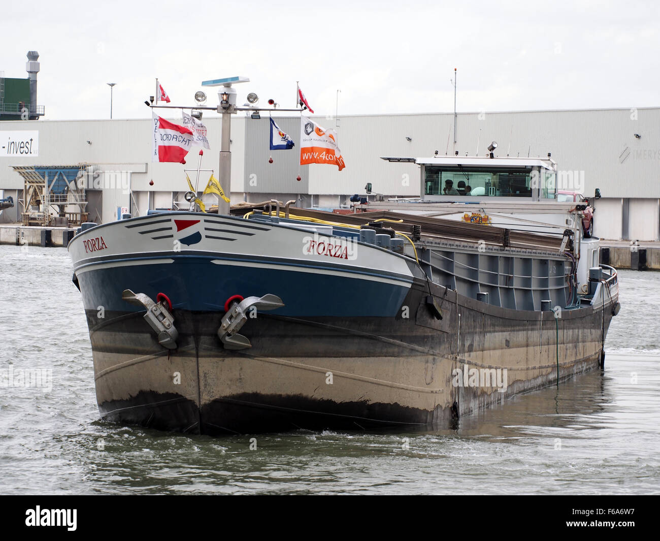 A photograph of the 'Forza,' a 1961-built container ship, docked at the ...