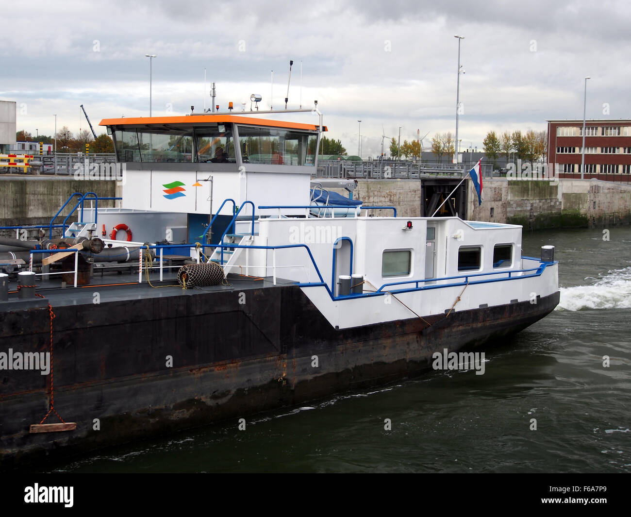 A photograph of the Isabella, a modern container ship docked at the ...