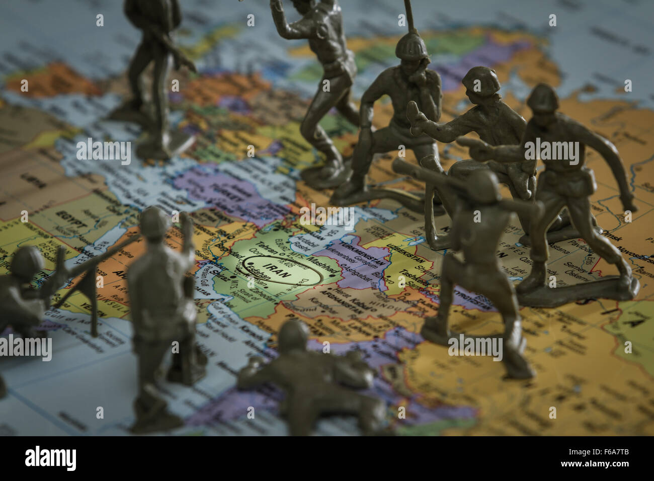 concept image using a wold map and toy soldiers to represent a war on ...