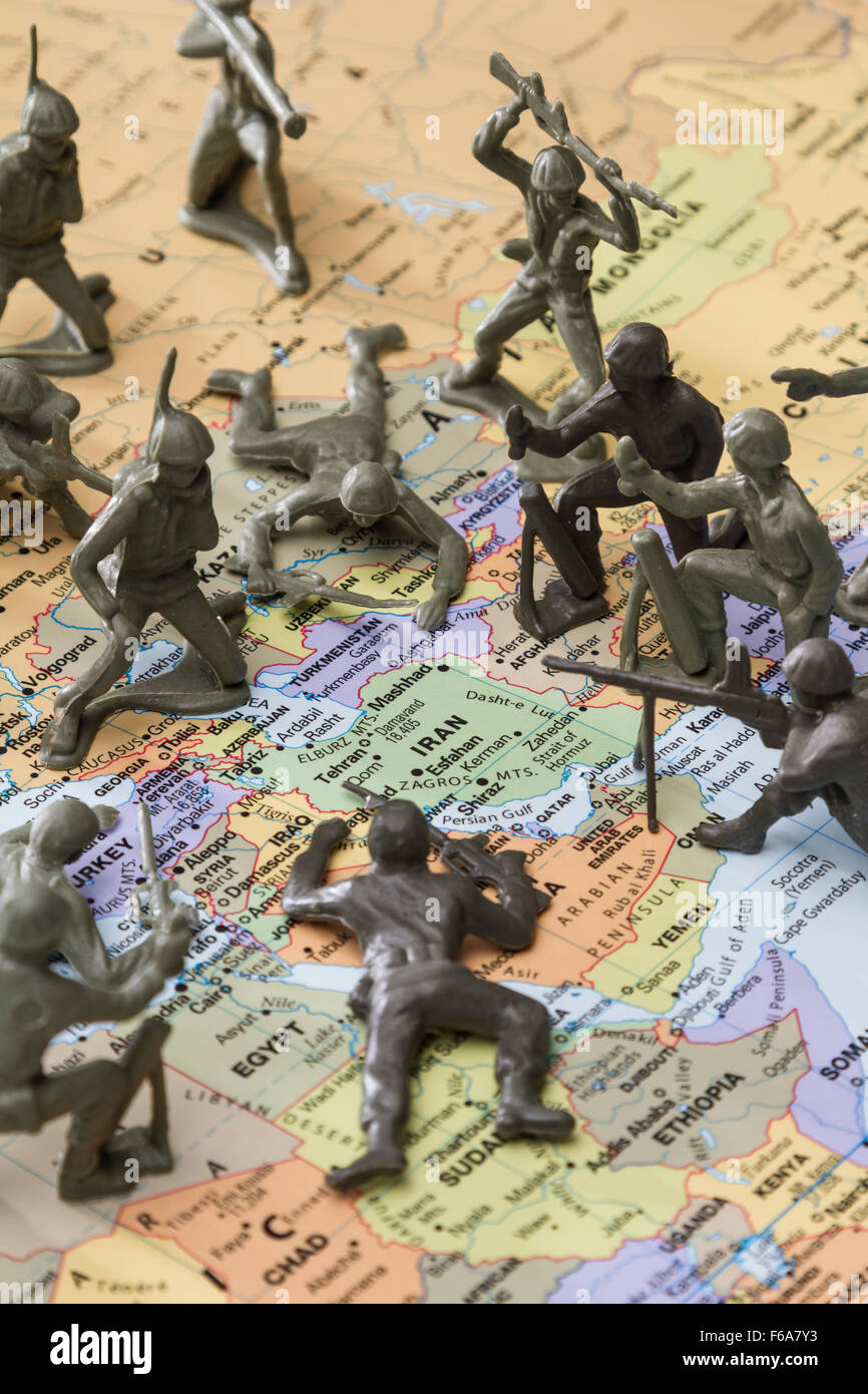 concept image using a wold map and toy soldiers to represent a war on ...