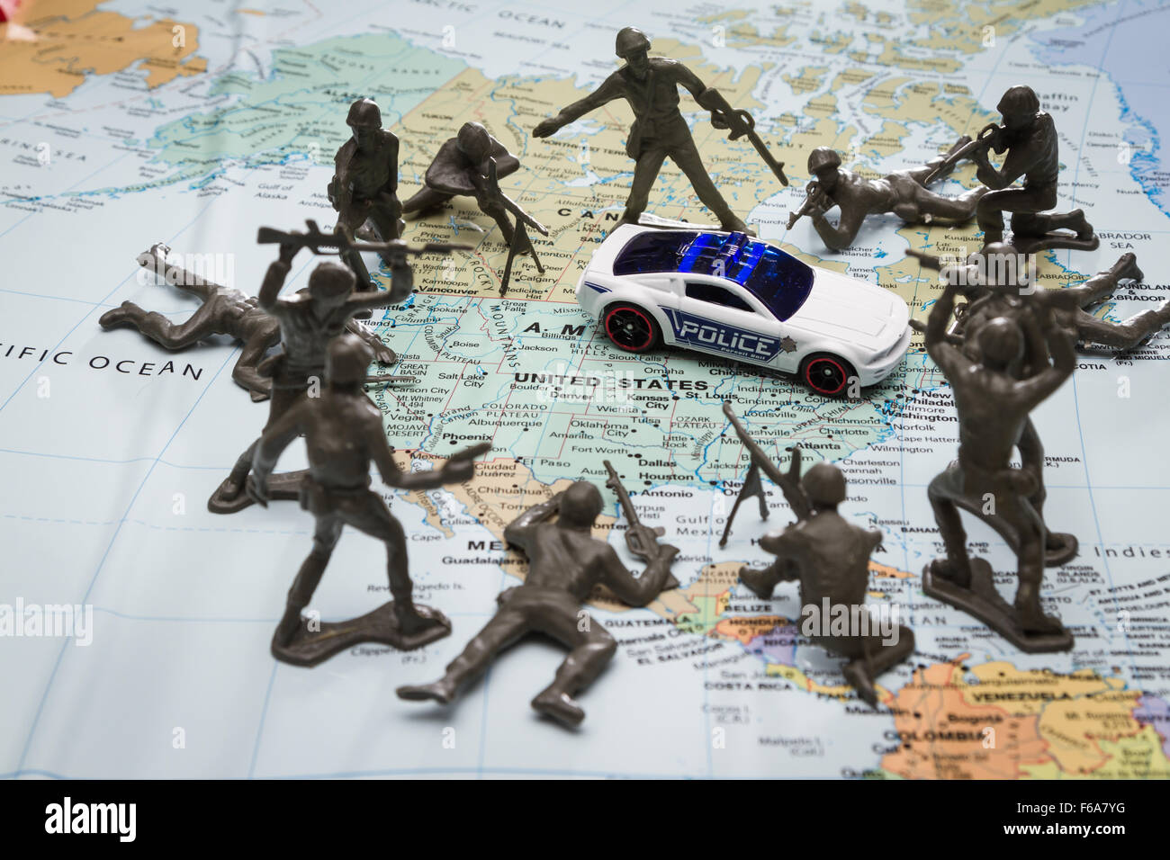 concept image using a wold map and toy soldiers to represent a war on ...
