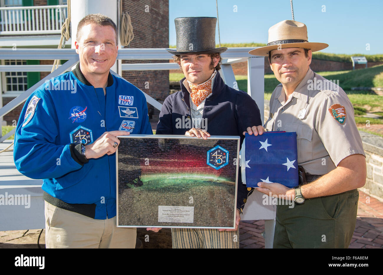 NASA astronaut Terry Virts presents a replica of the Star Spangled ...