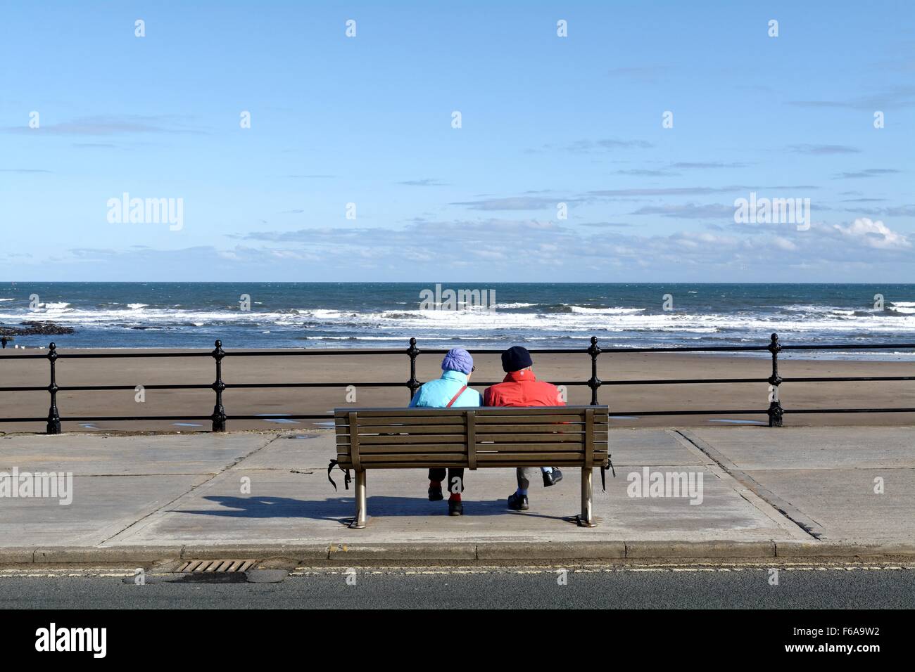 Old Couple Seaside Sitting On Stock Photos & Old Couple Seaside Sitting ...