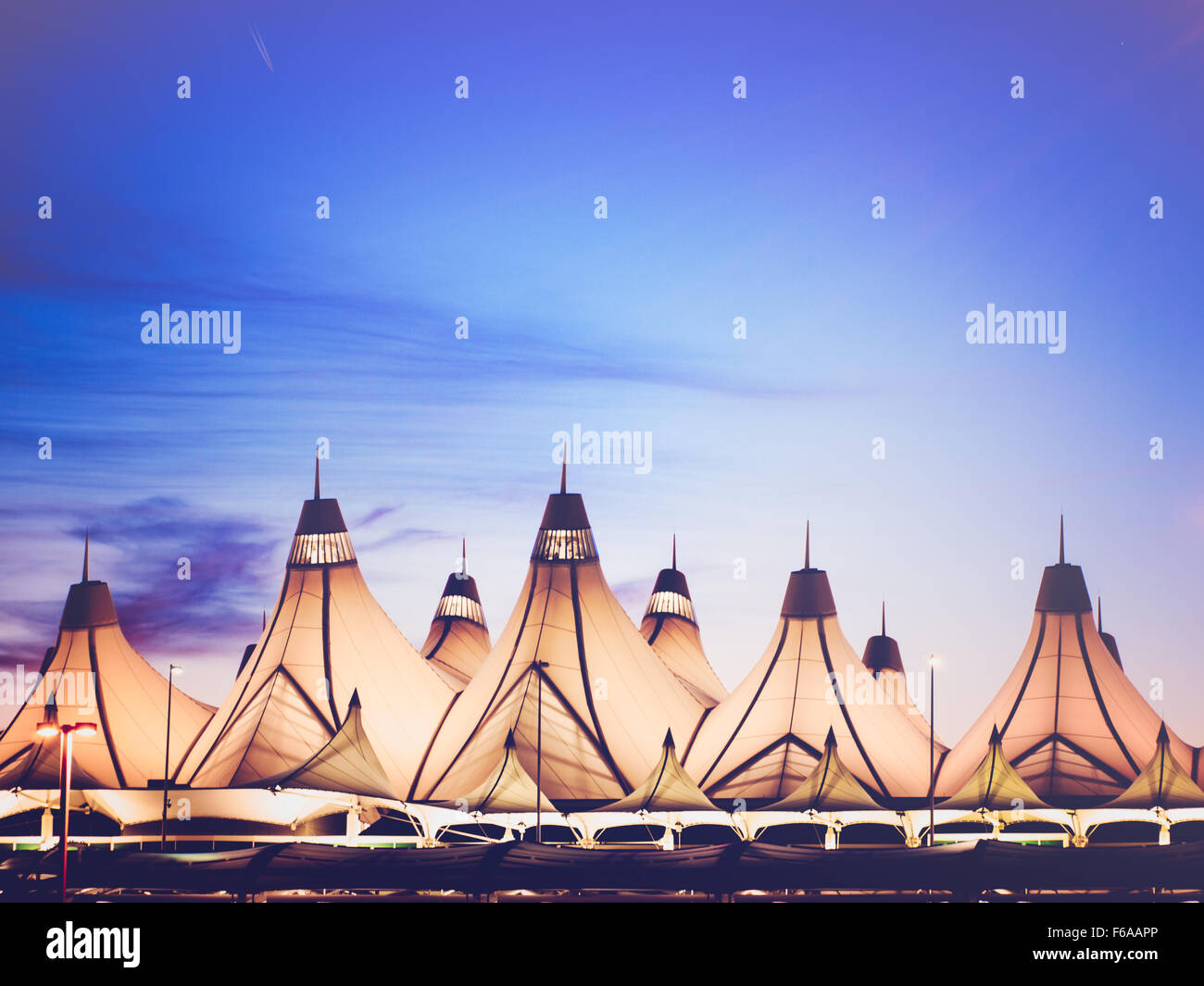 Glowing tents of DIA at sunrise. Denver International Airport well ...