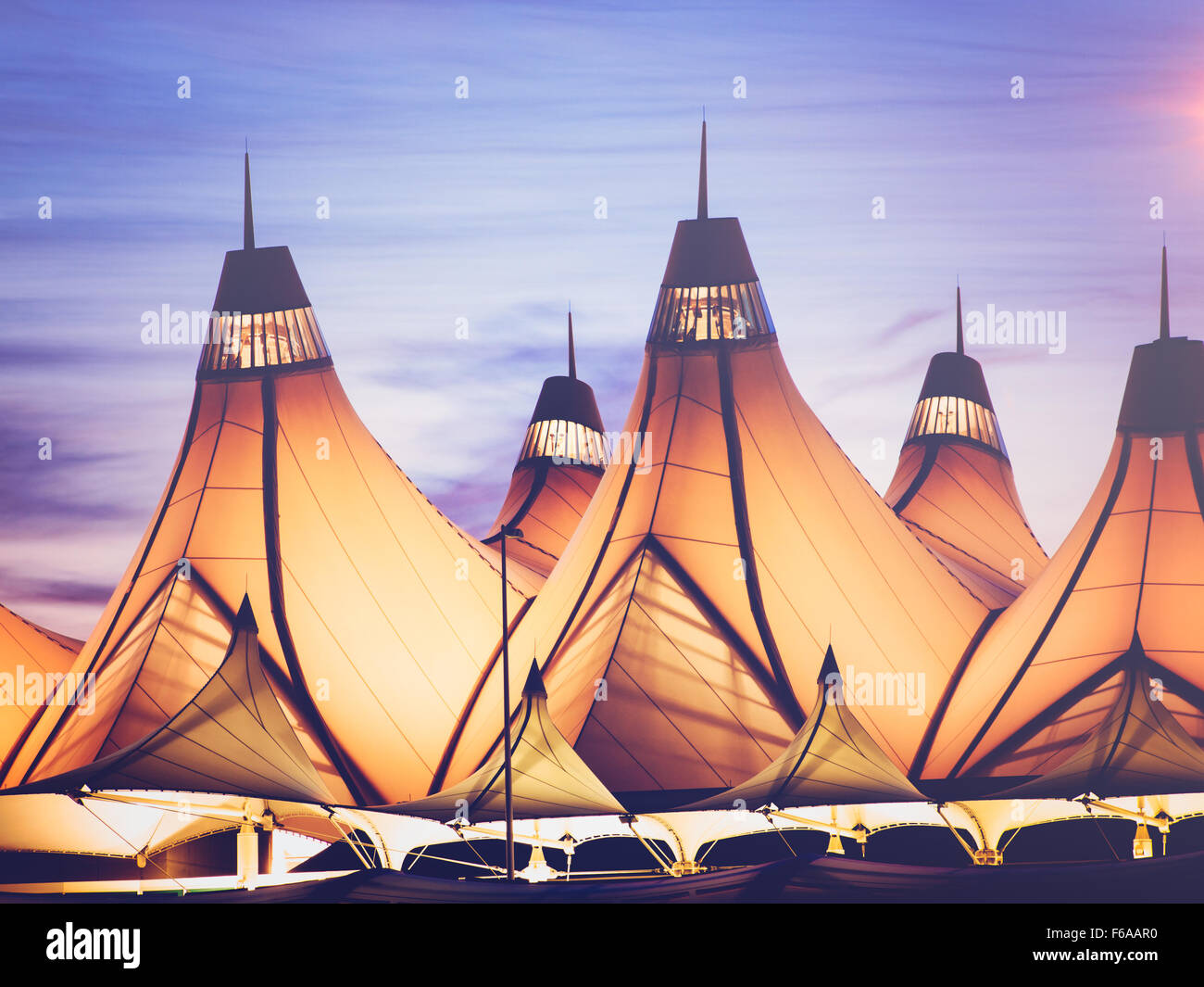 Glowing tents of DIA at sunrise. Denver International Airport well ...