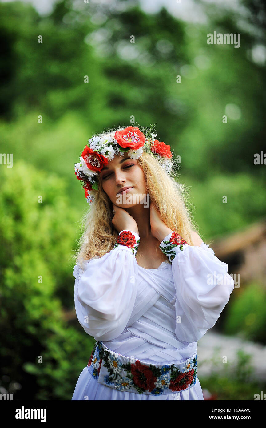 Young beautiful blonde girl in traditional dress Stock Photo - Alamy
