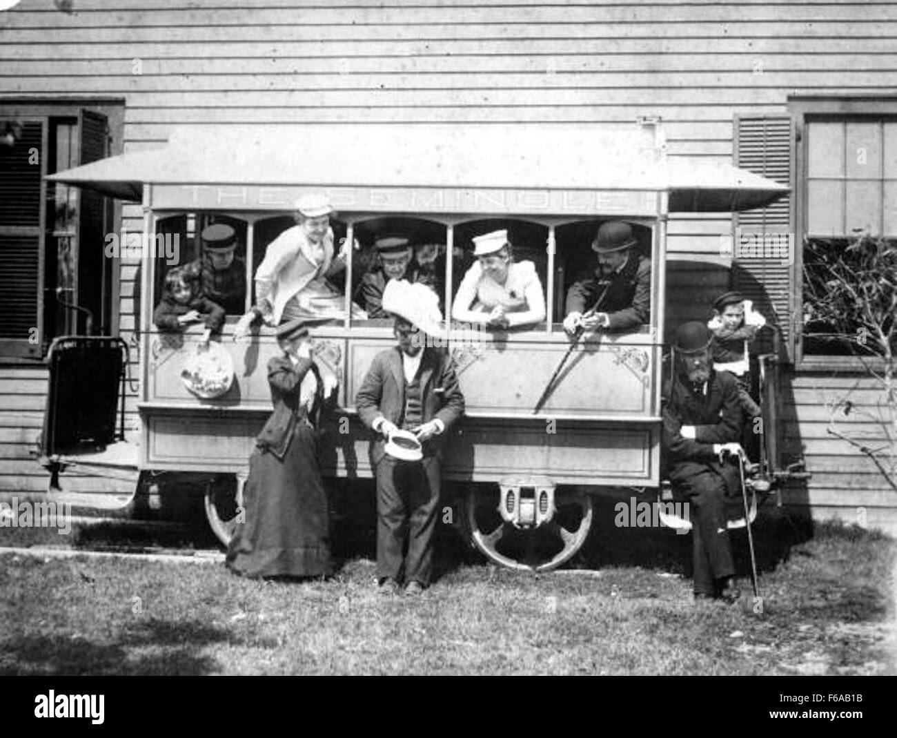 A group of people pose on a trolley car in Tampa, Florida. This image ...