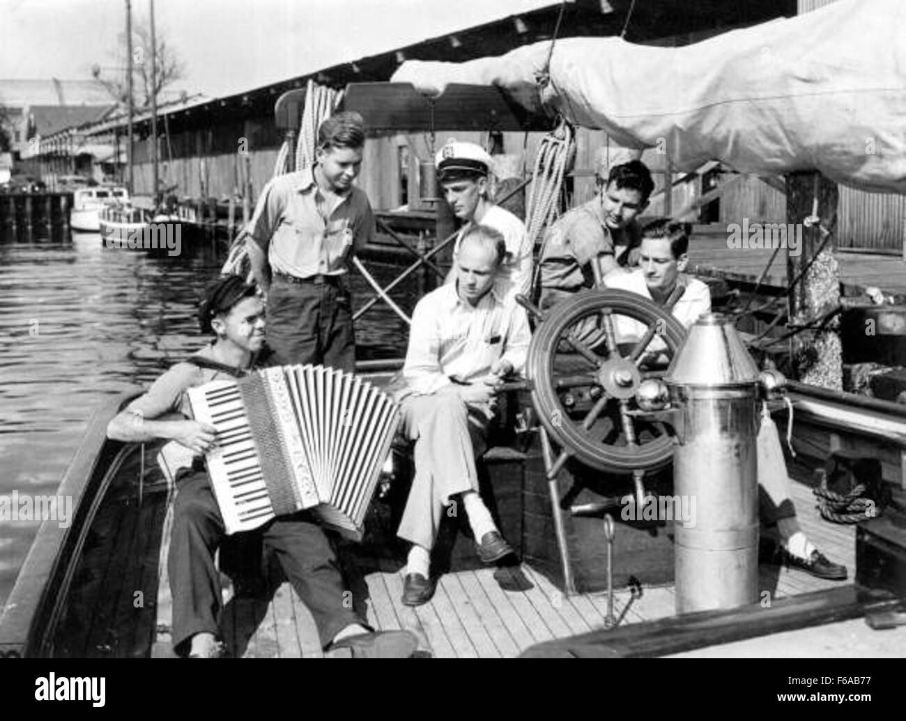 This photograph captures a group of men aboard the Nor'easter sailboat ...