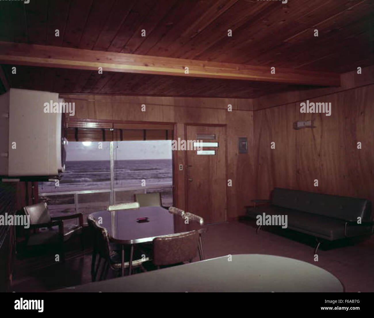 Interior view of a motel room in Florida, featuring a bed, dresser, and ...