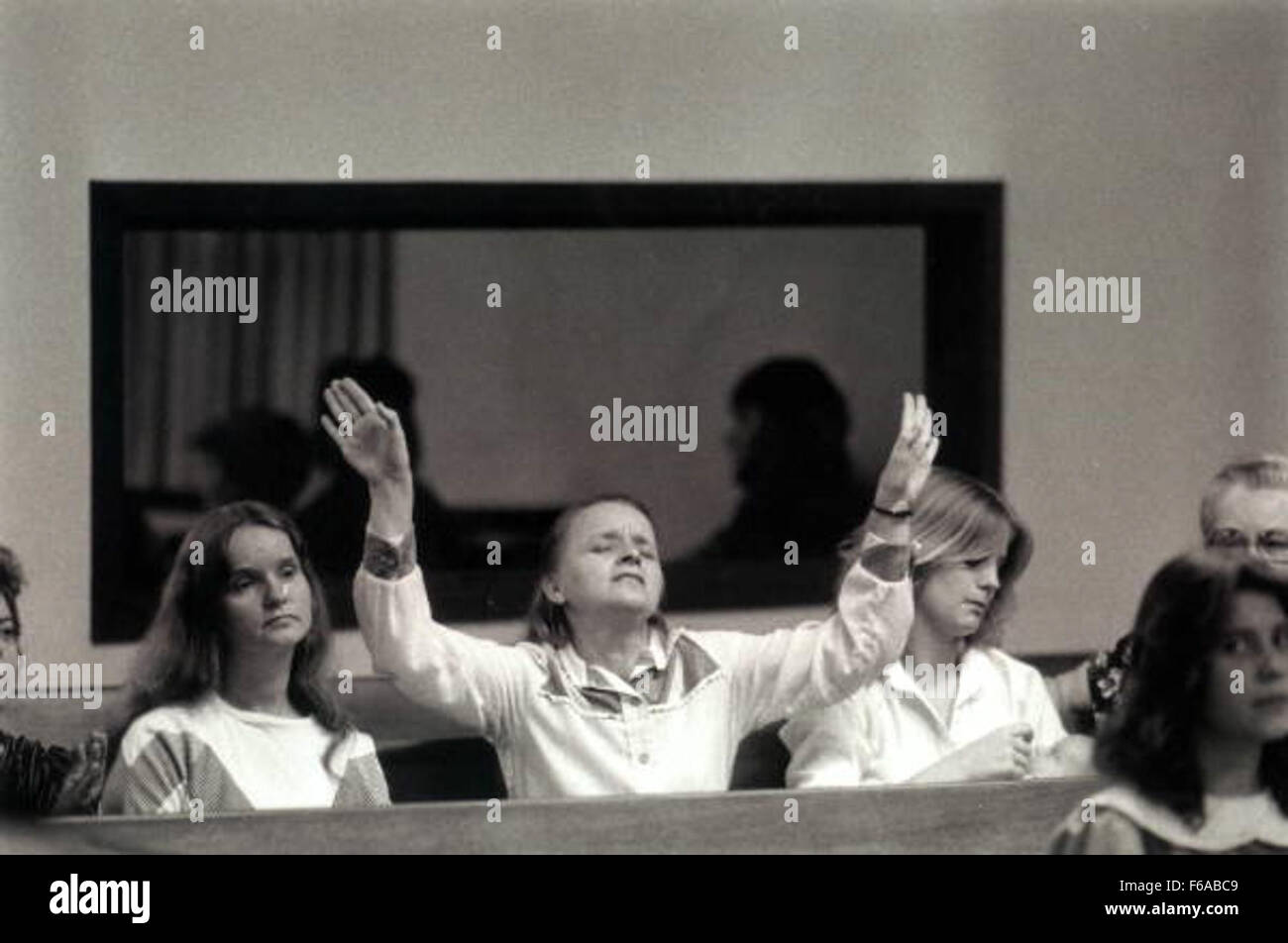 A photograph capturing women participating in a Pentecostal revival ...