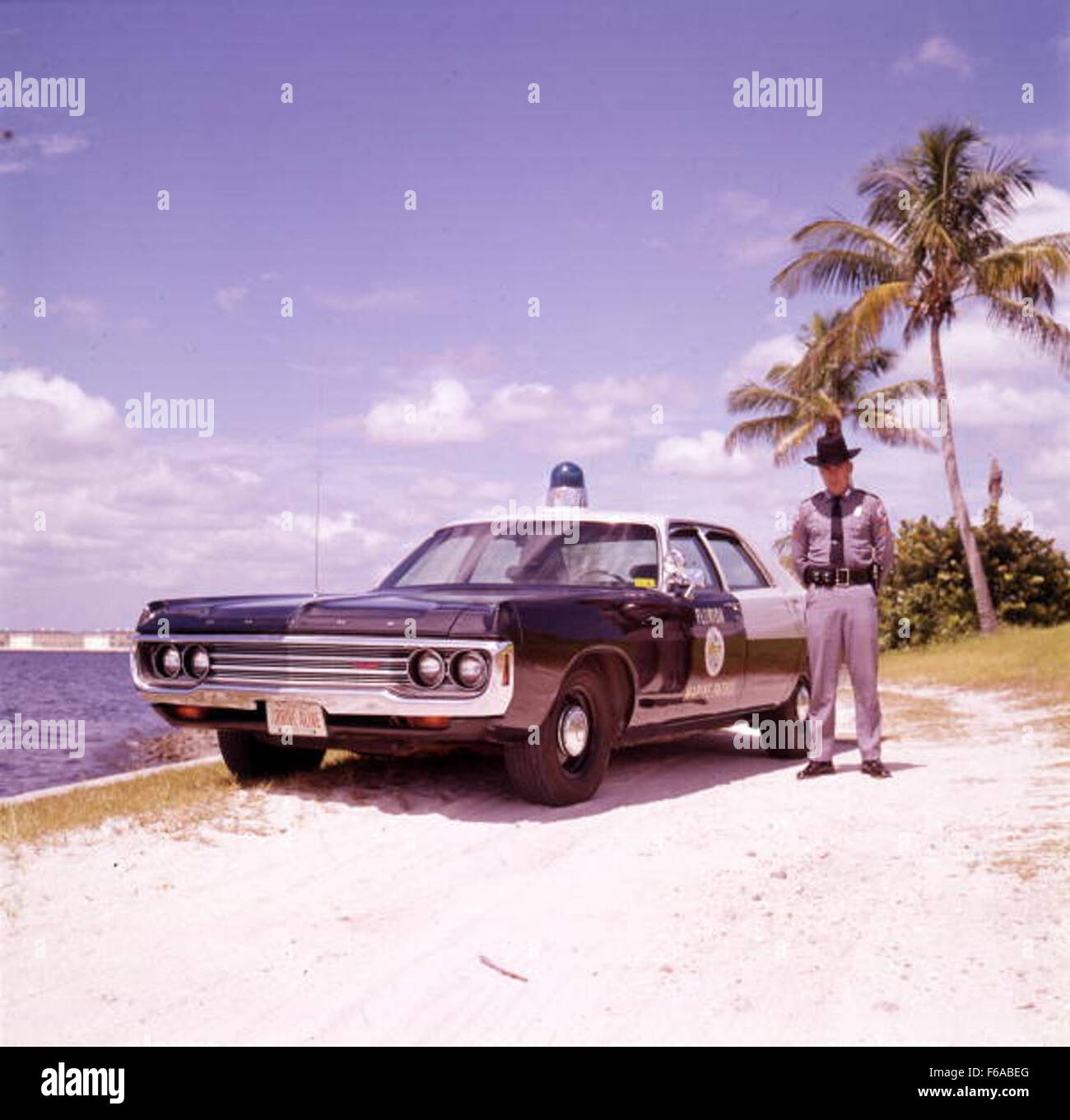A Florida Marine Patrol officer is seen with his patrol vehicle, a key ...