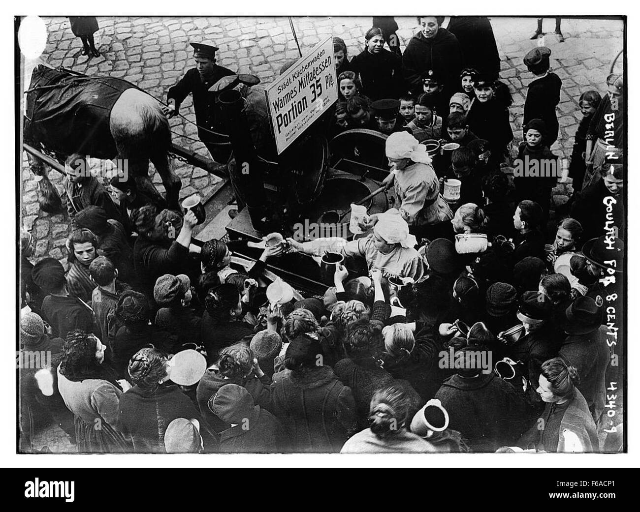 A snapshot of daily life in post-war Berlin, featuring a meal of ...