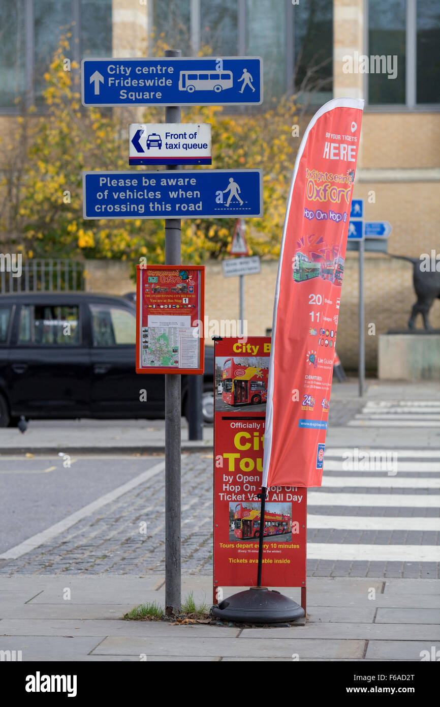 Sightseeing city tours sign and walking directional sign post in Oxford ...