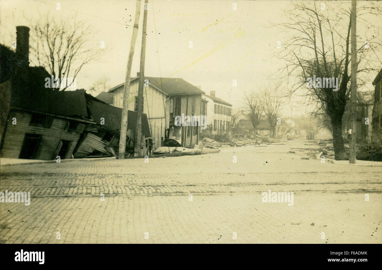 The image shows flood damage in Hamilton, Ohio, capturing the impact of ...