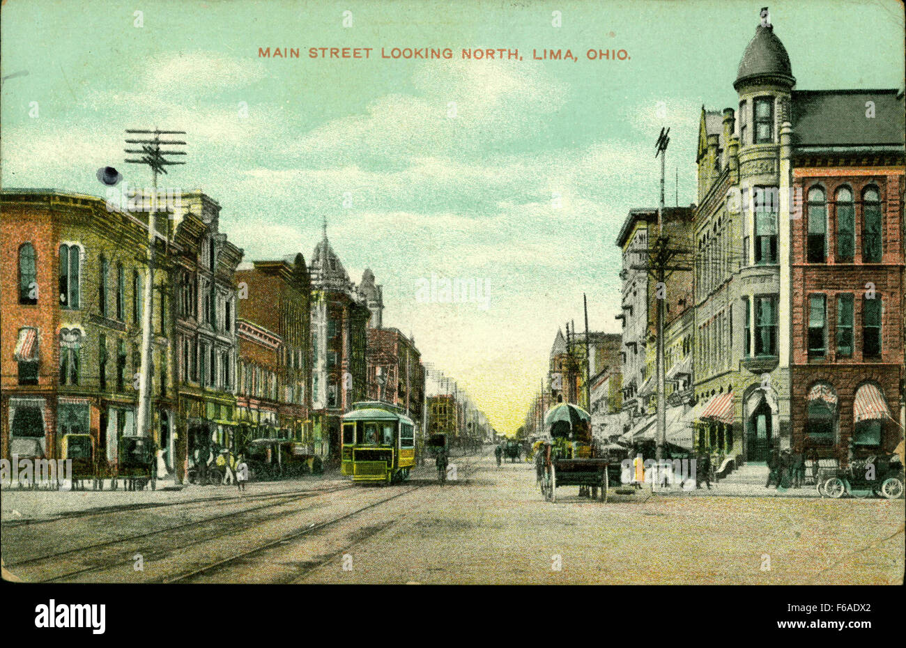 This postcard image shows a view of Main Street in Lima, Ohio, looking ...