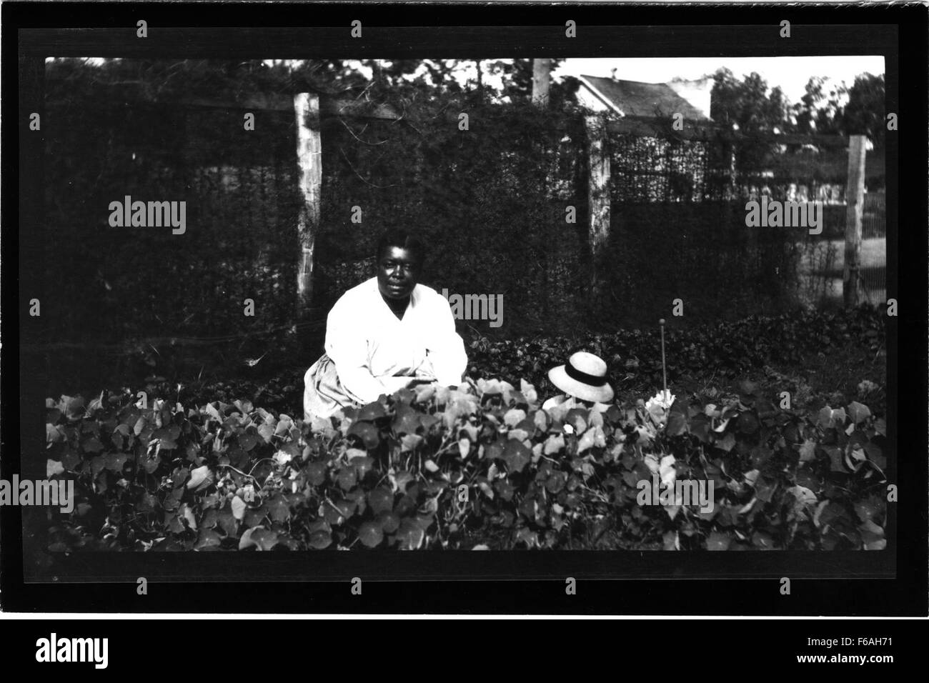 This image features Minnie, a cook, and Mary Heldon. The photograph may ...