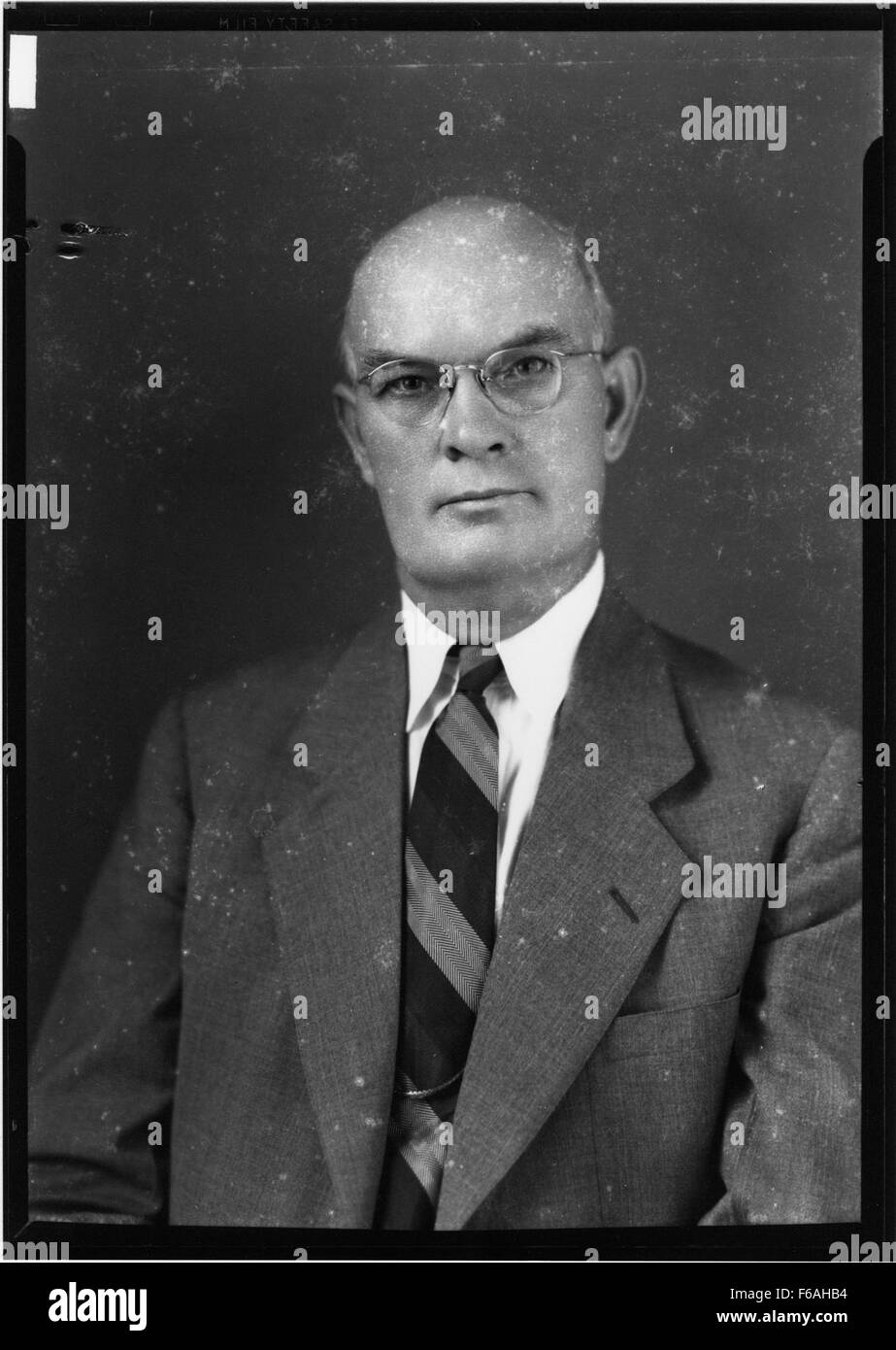 This portrait photograph features an unidentified man, providing a ...