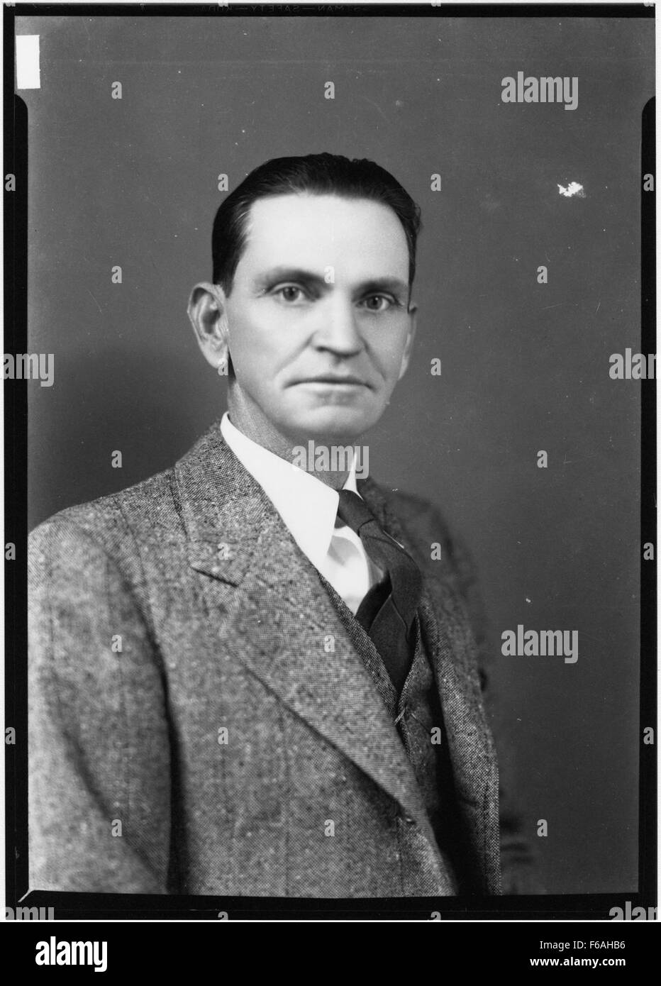This portrait photograph features an unidentified man, capturing his ...