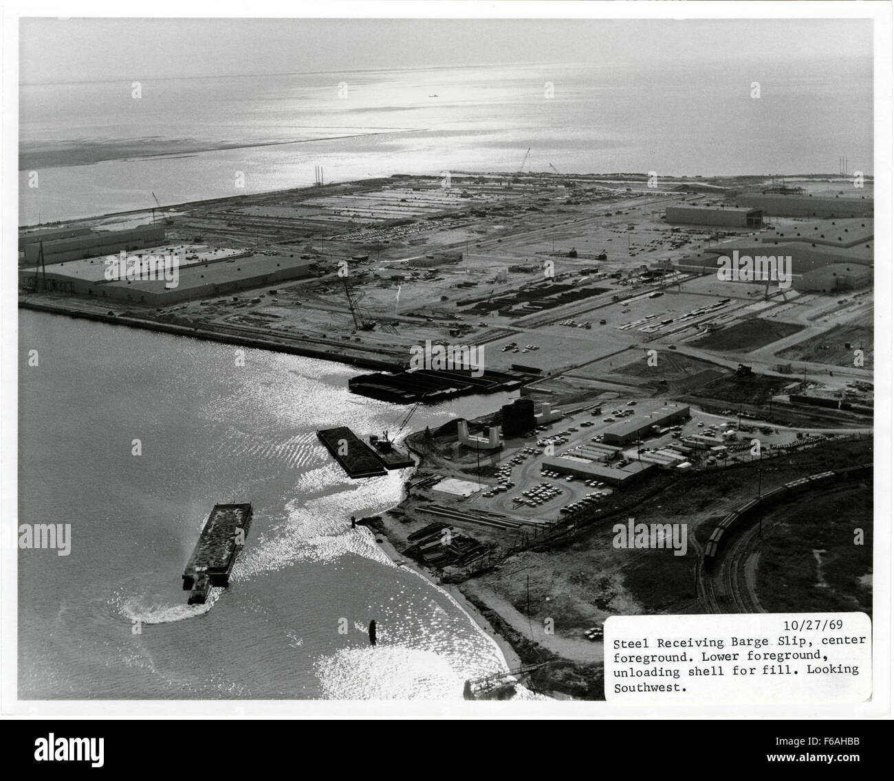 The image depicts a steel receiving barge slip, with a focus on the ...