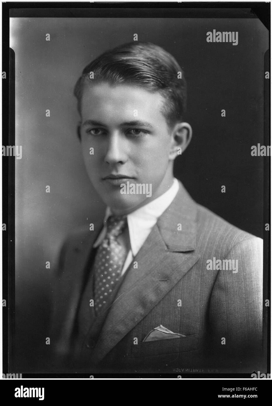 A portrait of an unidentified man, capturing a moment in time. The ...