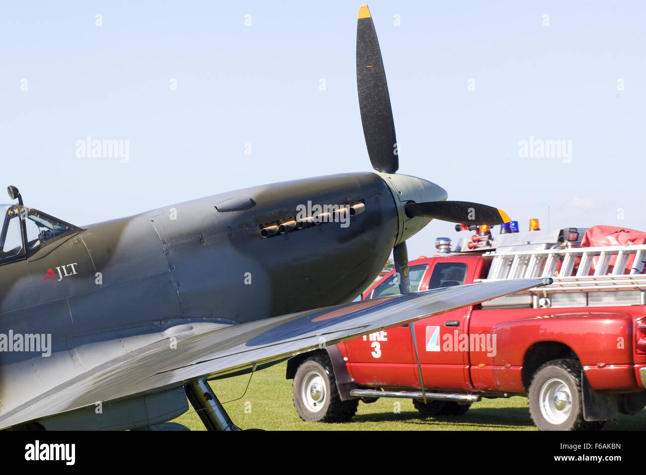 The Grace Spitfire ML407 with an Aviation fire truck standing by Stock ...