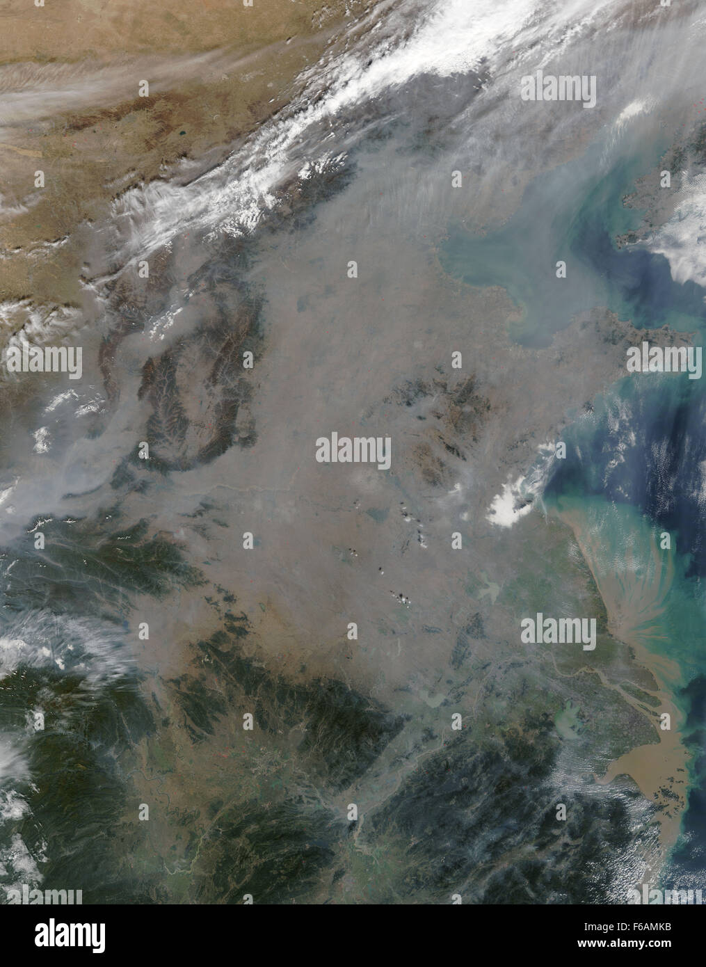 A satellite image captured haze over eastern China, illustrating ...