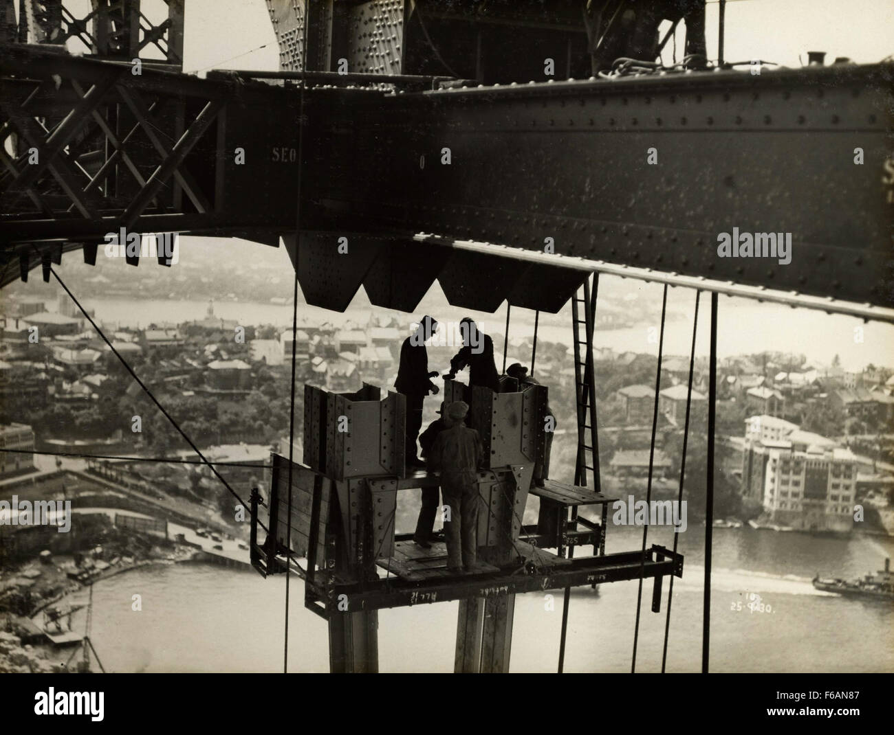 An archival image showing the lifting of Hanger O during the ...