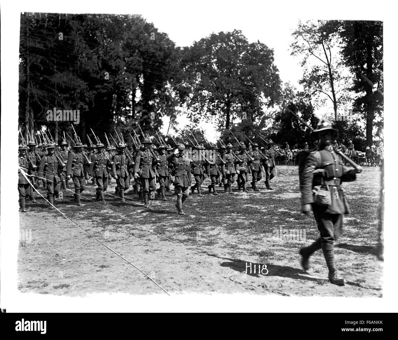 This historical photograph captures New Zealand troops marching during ...