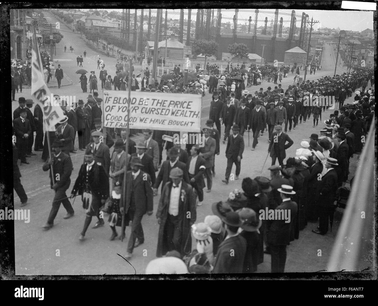 This photograph captures a protest march in Auckland during the ...