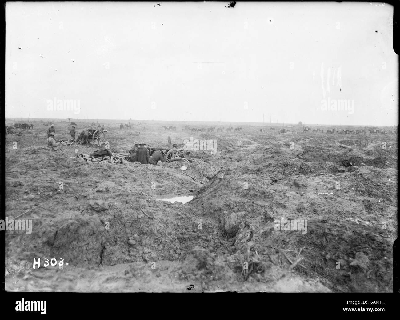 This image shows New Zealand artillery units firing from shell-holes at ...