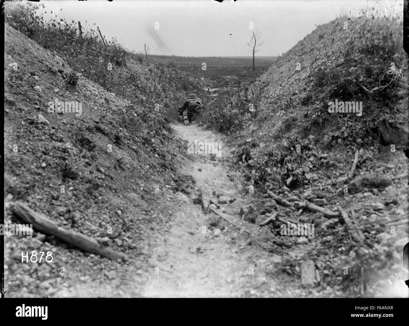 A soldier is captured running through a front-line trench during World ...