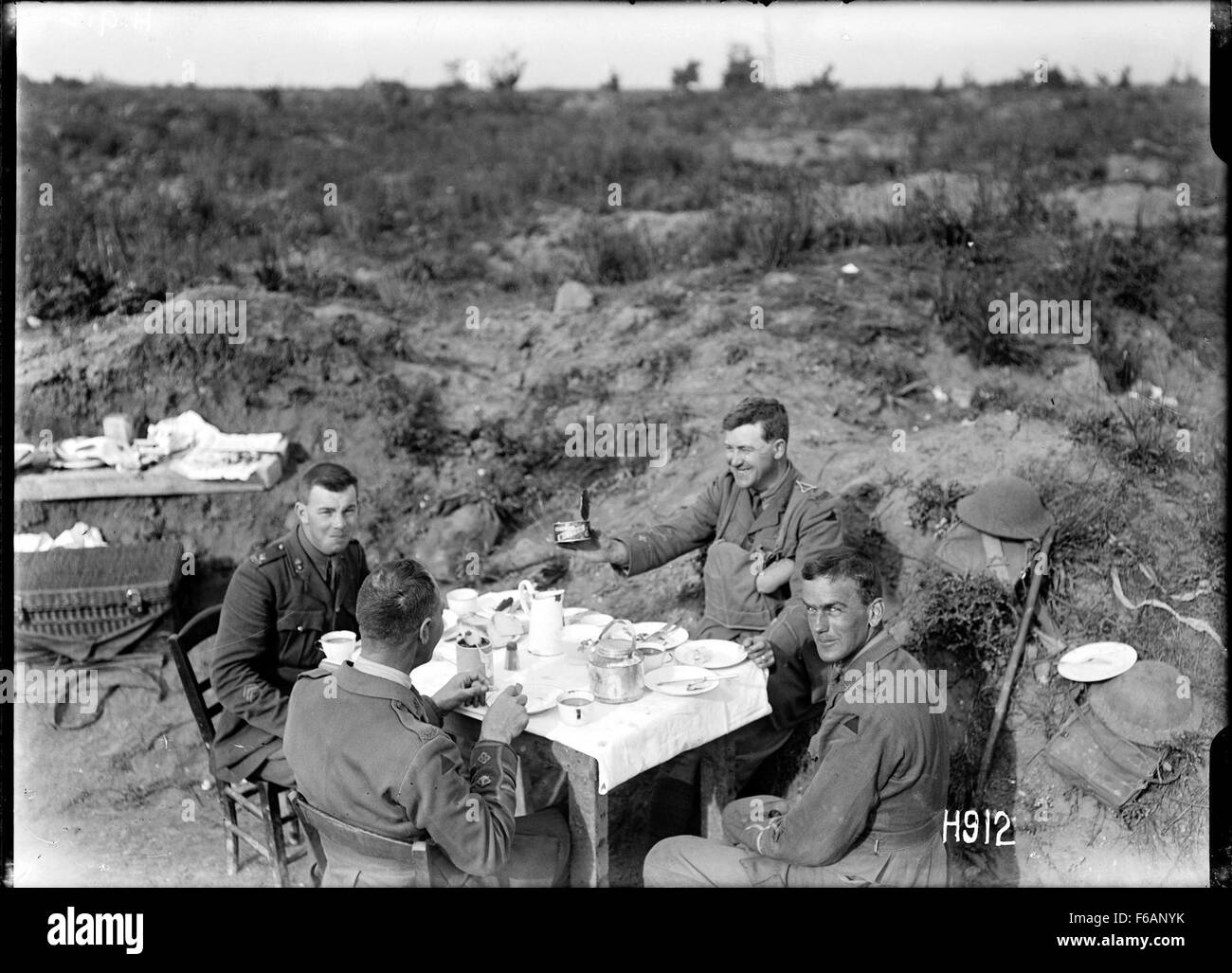 A historical photograph of New Zealand officers eating breakfast in a ...