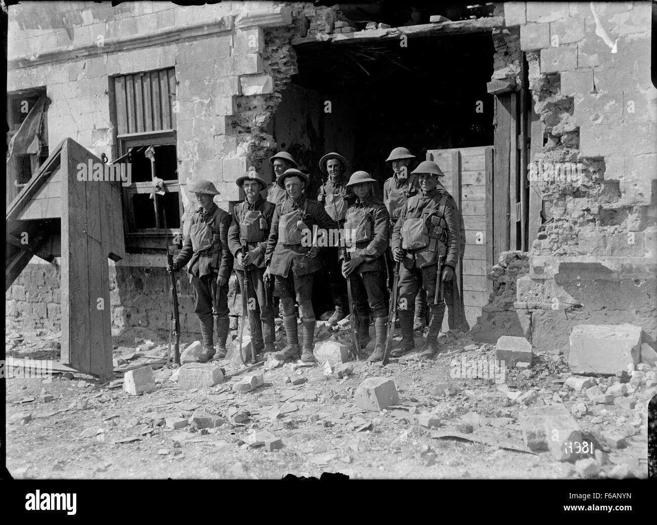 This historical image depicts New Zealand Riflemen in Bapaume ...
