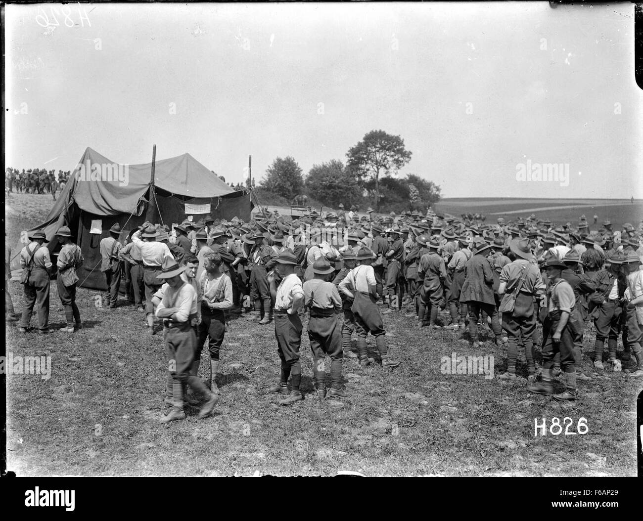 This photograph shows New Zealand soldiers operating a totalisator ...