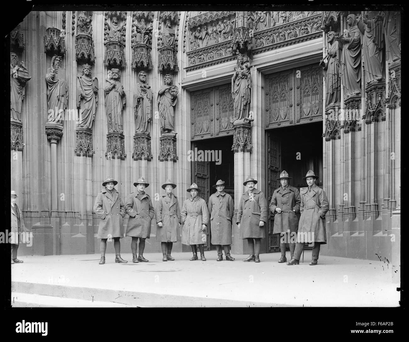This photograph shows New Zealand soldiers standing on the steps of the ...