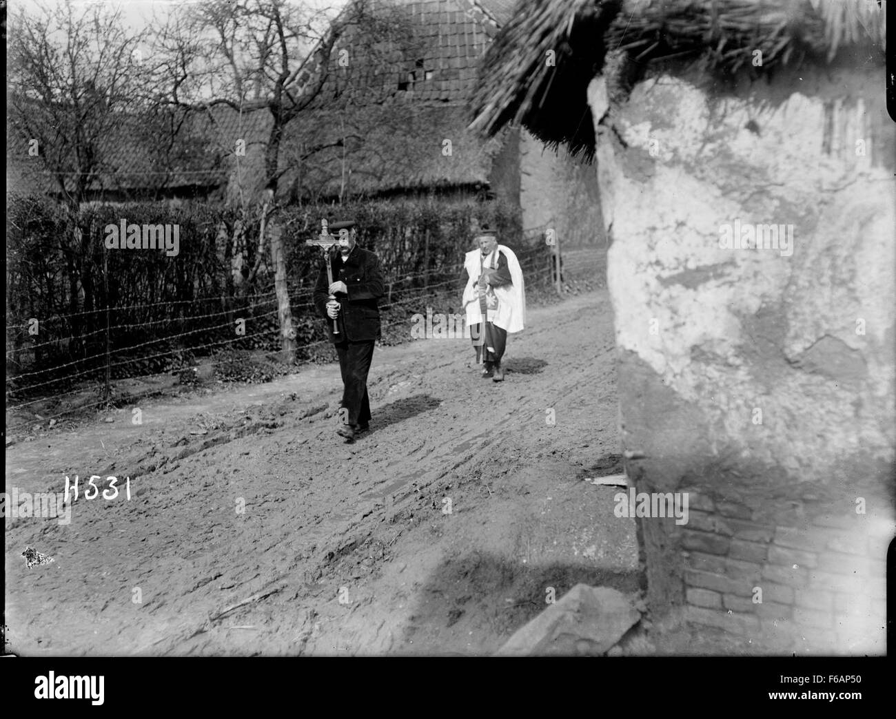 This artwork likely depicts a village priest on his way to attend to ...