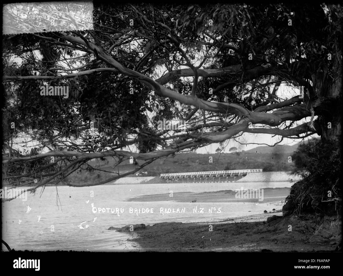 The photograph shows the Opotoru Bridge over Raglan Harbour, located in ...