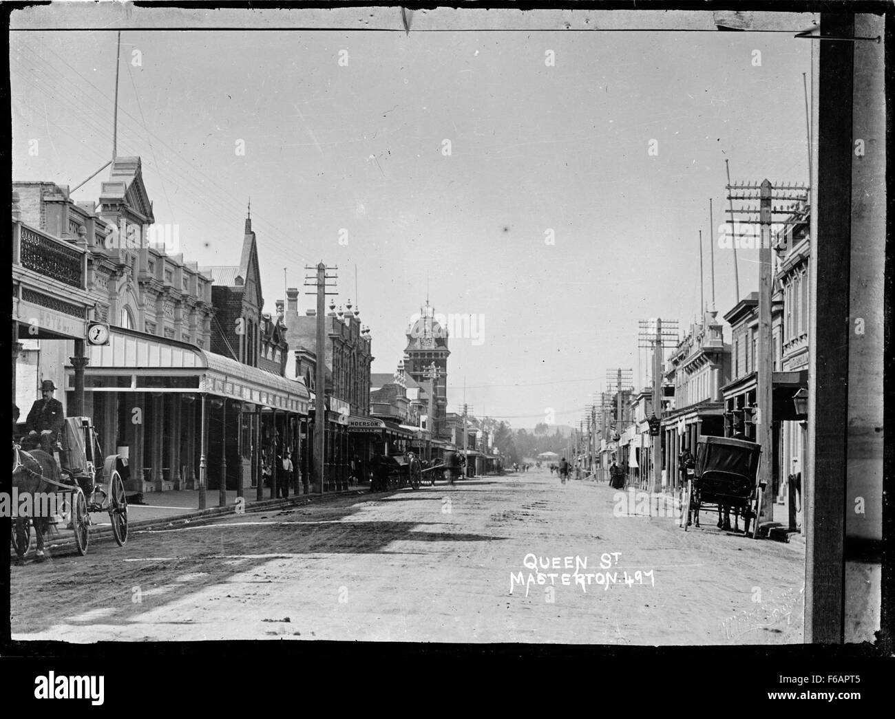 A historic photograph of Queen Street in Masterton, capturing the early ...