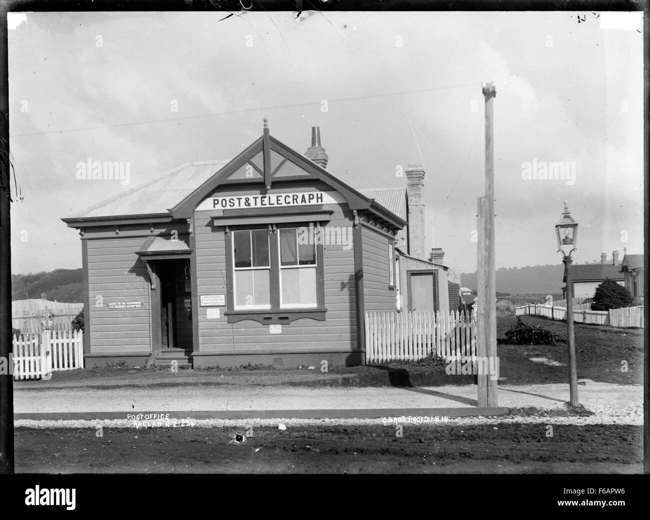 A historical photograph of the Raglan Post Office in 1910, taken by ...