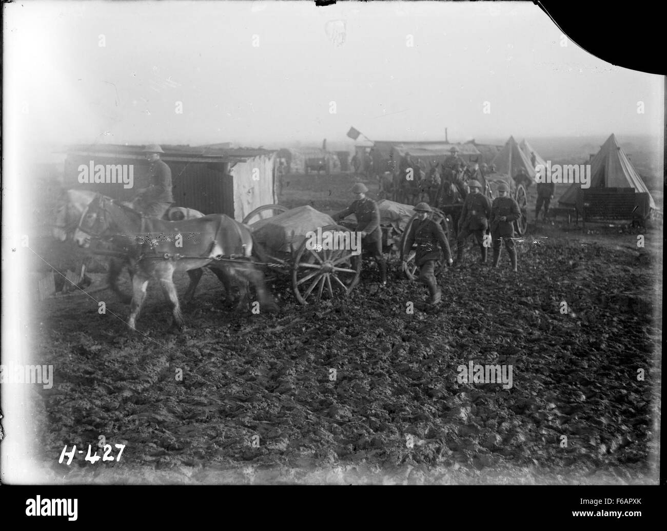 This historical photograph depicts military rations being delivered ...