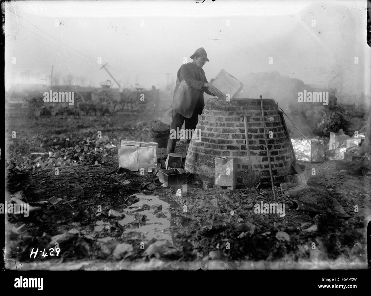 This photograph depicts soldiers recycling solder during World War I on ...