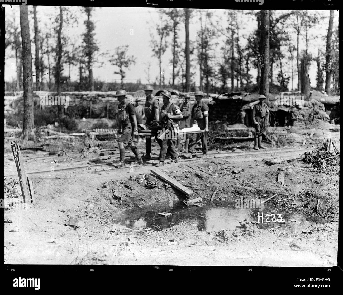 This photograph shows stretcher bearers at work in Ploegsteert Wood ...