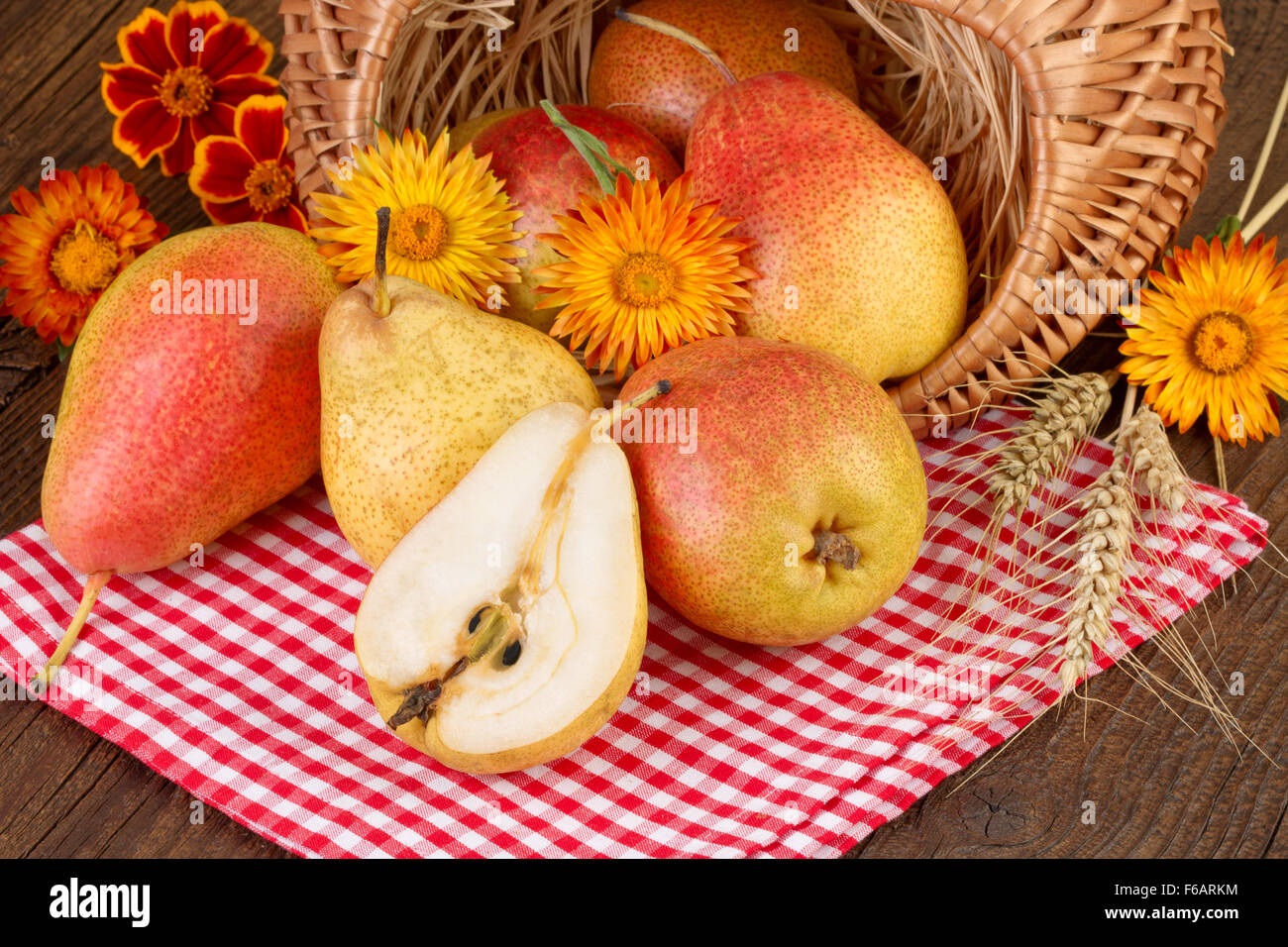 Pears Fruit on red checkered tablecloth Stock Photo - Alamy