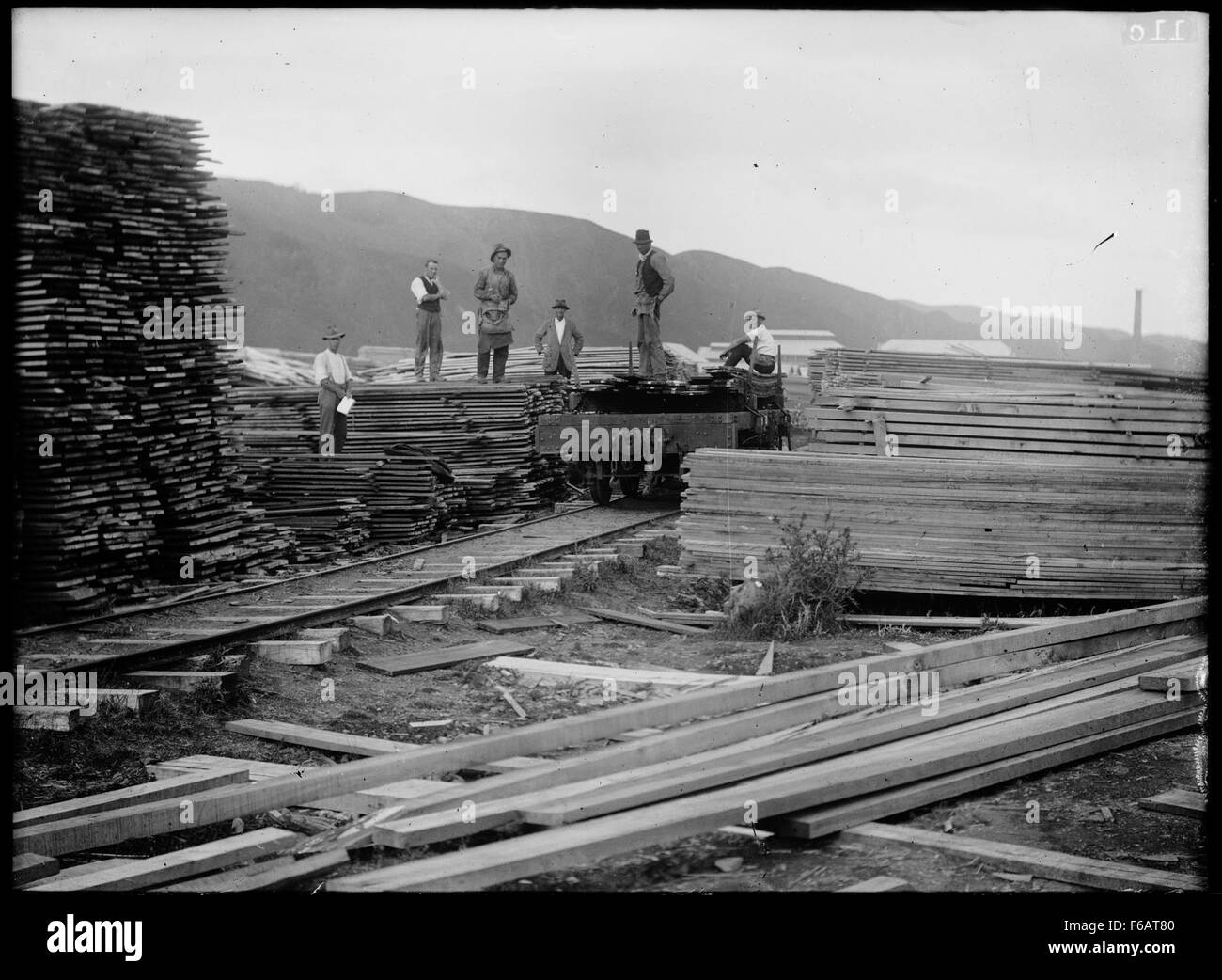 This image shows a stack of timber in a sawmill yard, providing insight ...